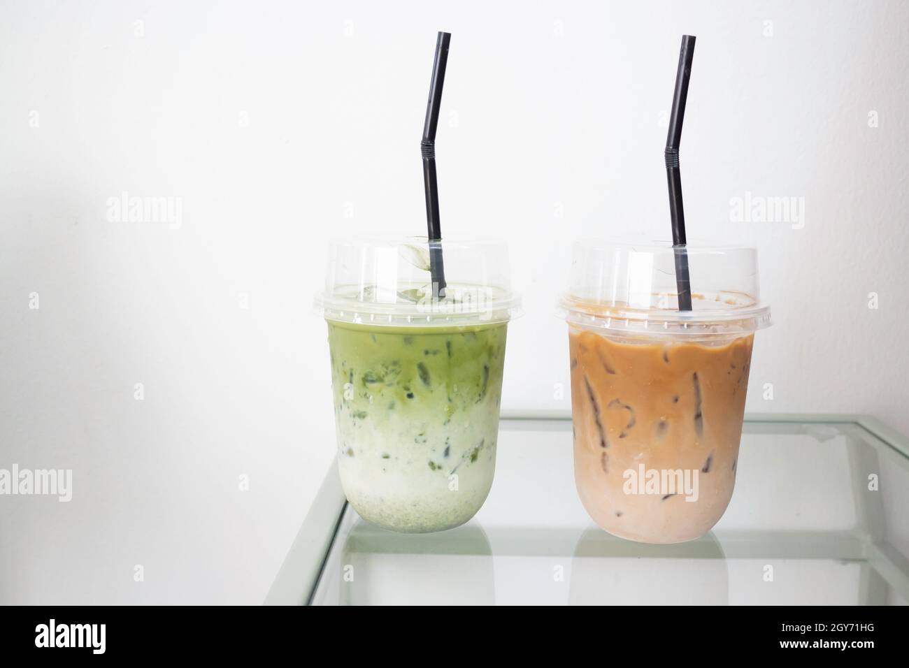 Iced milk coffee and green tea drink, stock photo Stock Photo - Alamy