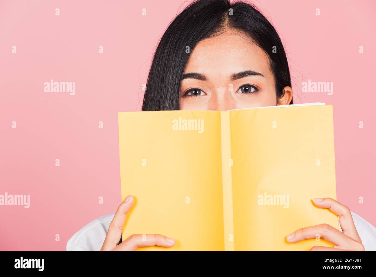 Portrait of beautiful Asian young woman teen smile covering her face ...