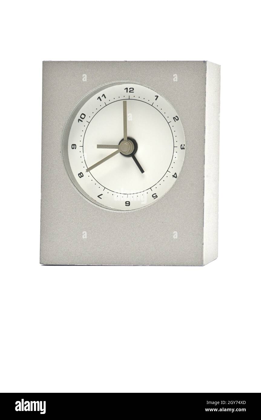 Silver metal clock on an isolated white background.Watch Stock Photo ...