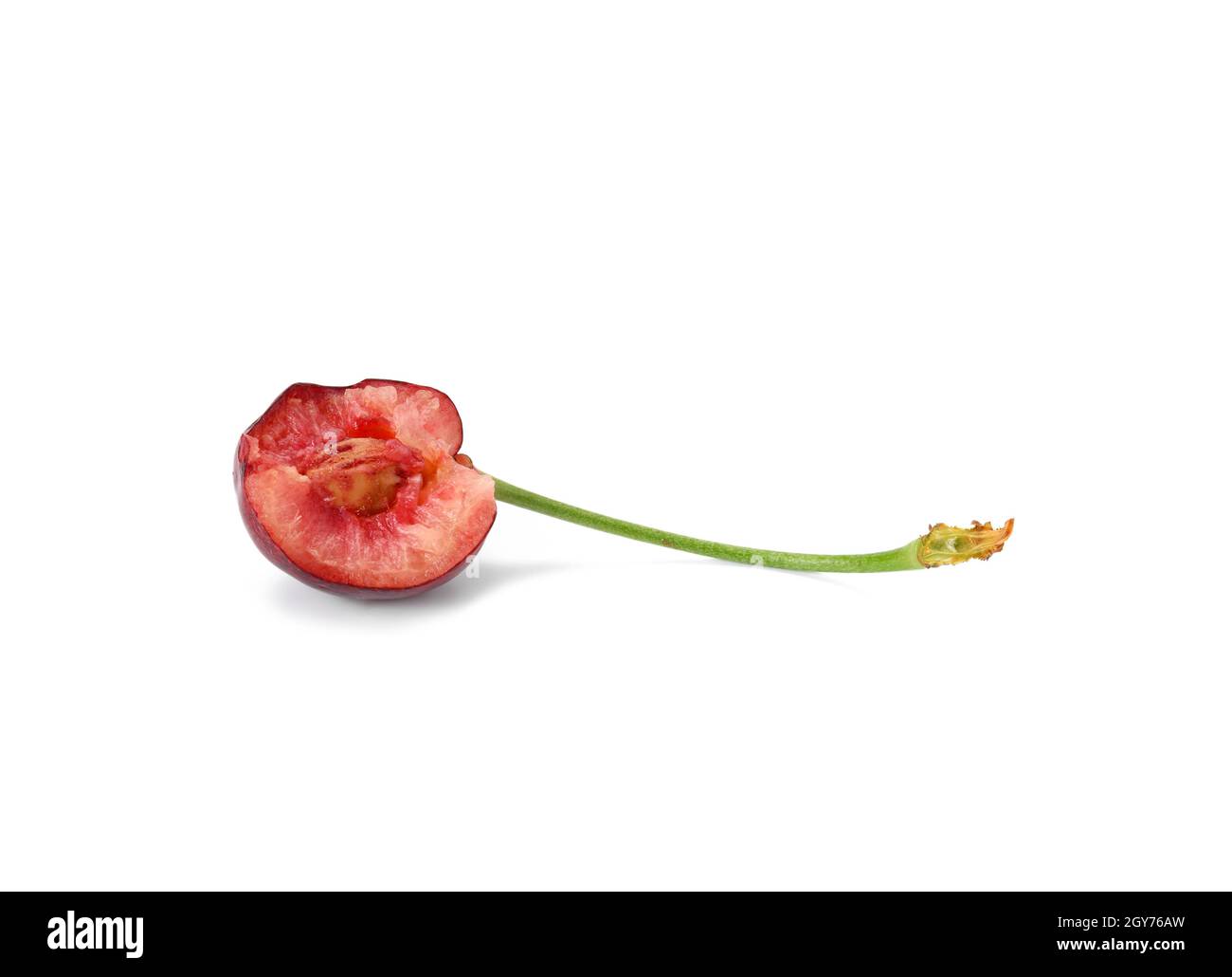 half ripe red cherry with bone isolated on white background, close up ...