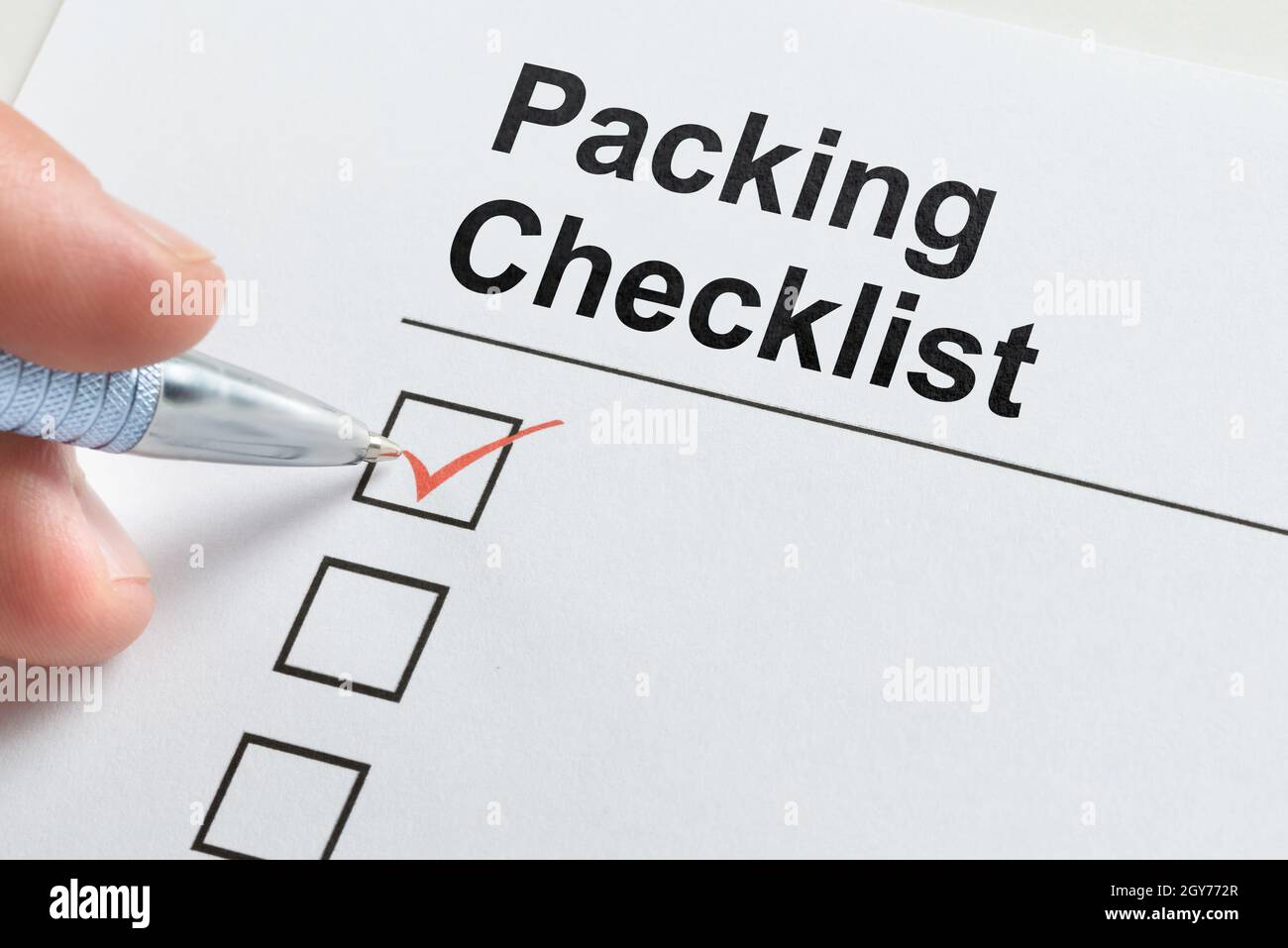 Packing And Travel Checklist. Hand Filling Check List Stock Photo - Alamy