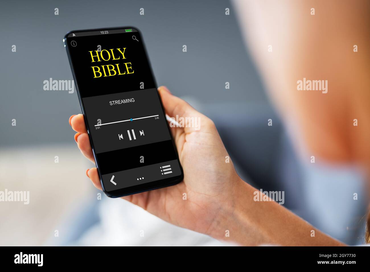 Woman Reading Bible Book On Phone And Praying Stock Photo - Alamy