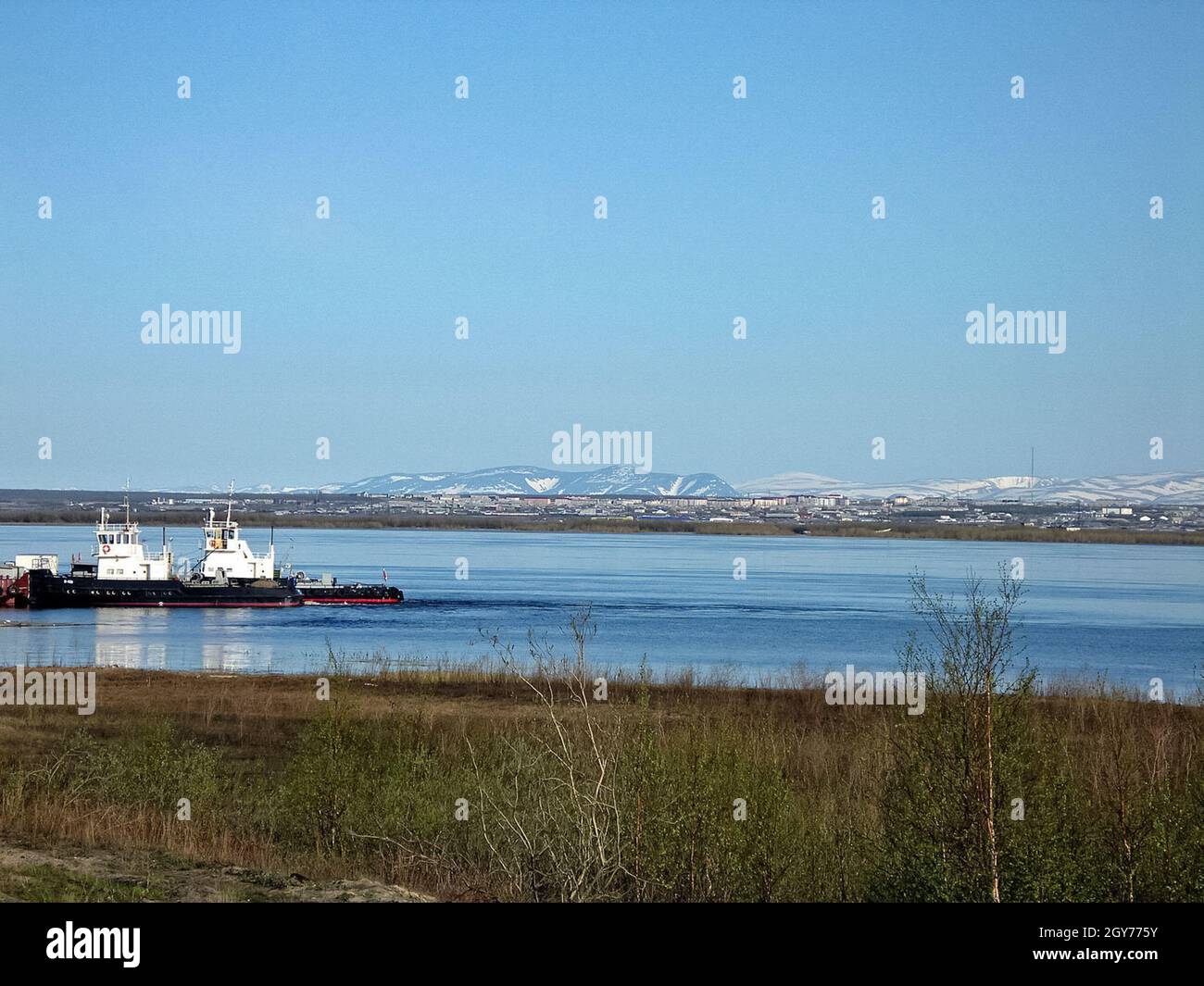 River port on the river of the city of Salekhard. Port cranes and ships ...