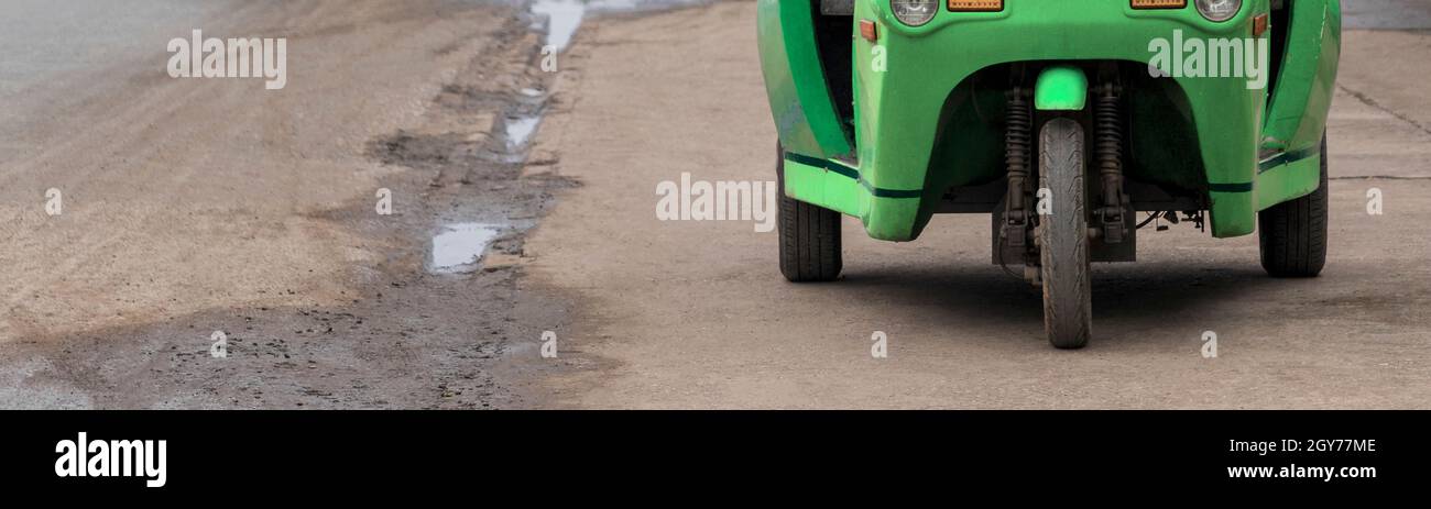 Green and yellow eco-friendly electronic tuk tuk vehicle car rickshaw ...