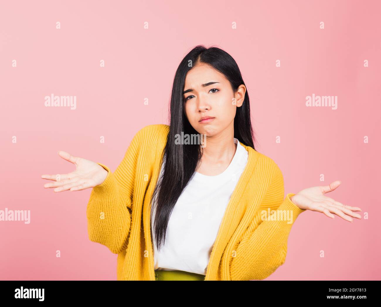 Asian portrait beautiful cute young woman teen shrugging with spread ...