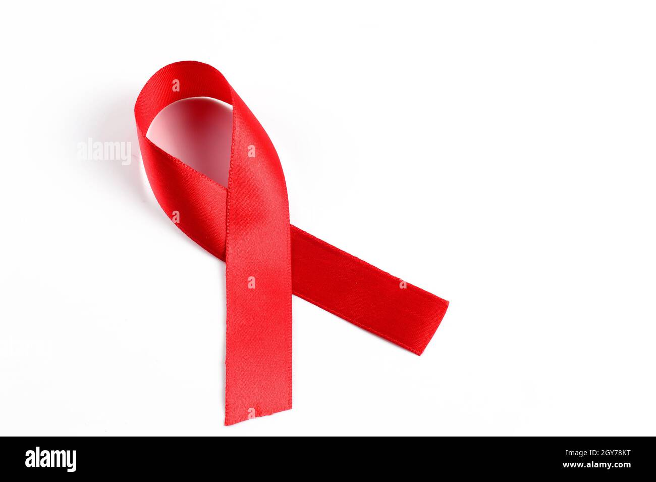 Aids Awareness Red Ribbon on white background Stock Photo - Alamy