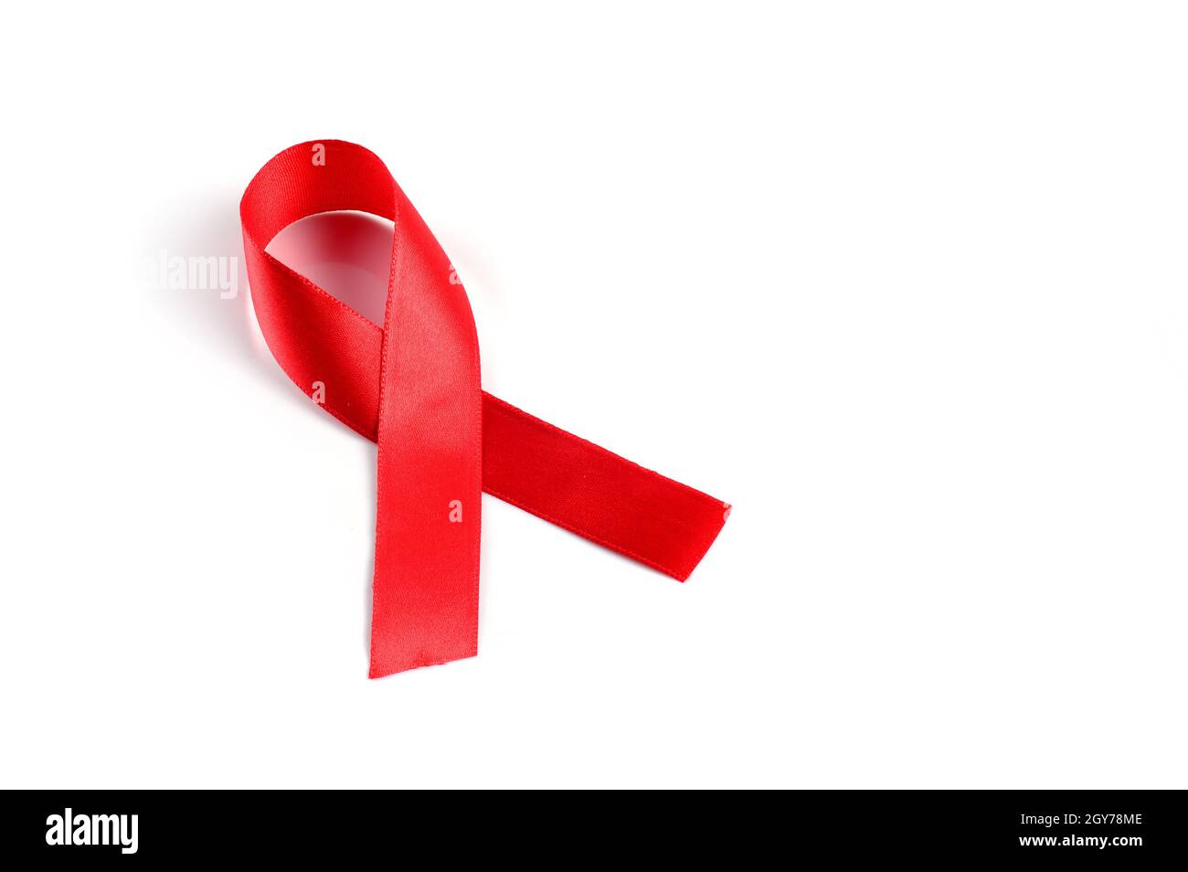 Aids Awareness Red Ribbon on white background Stock Photo - Alamy