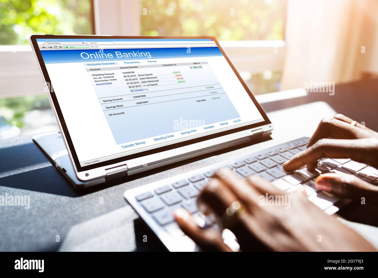 Internet Bank Transfer Using Checking Account Online Stock Photo - Alamy