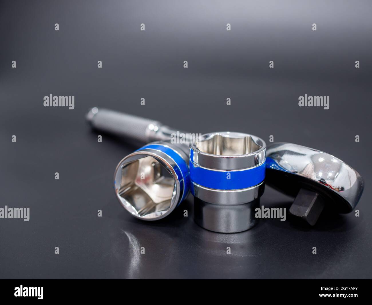 block wrench set and ratchet wrench on a black background.Block wrench ...