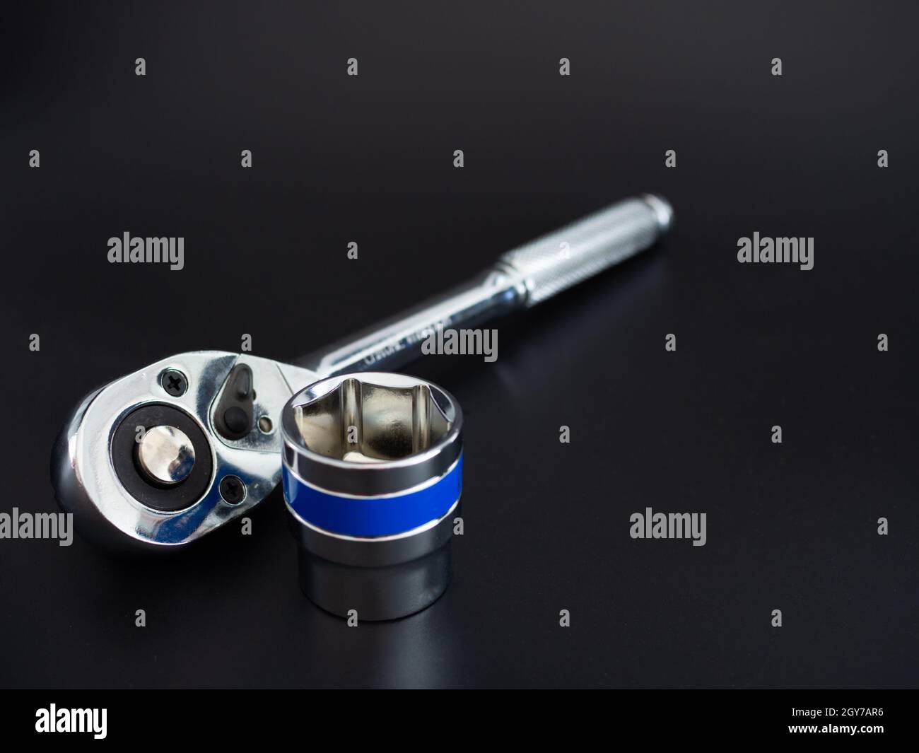 block wrench set and ratchet wrench on a black background.Block wrench ...