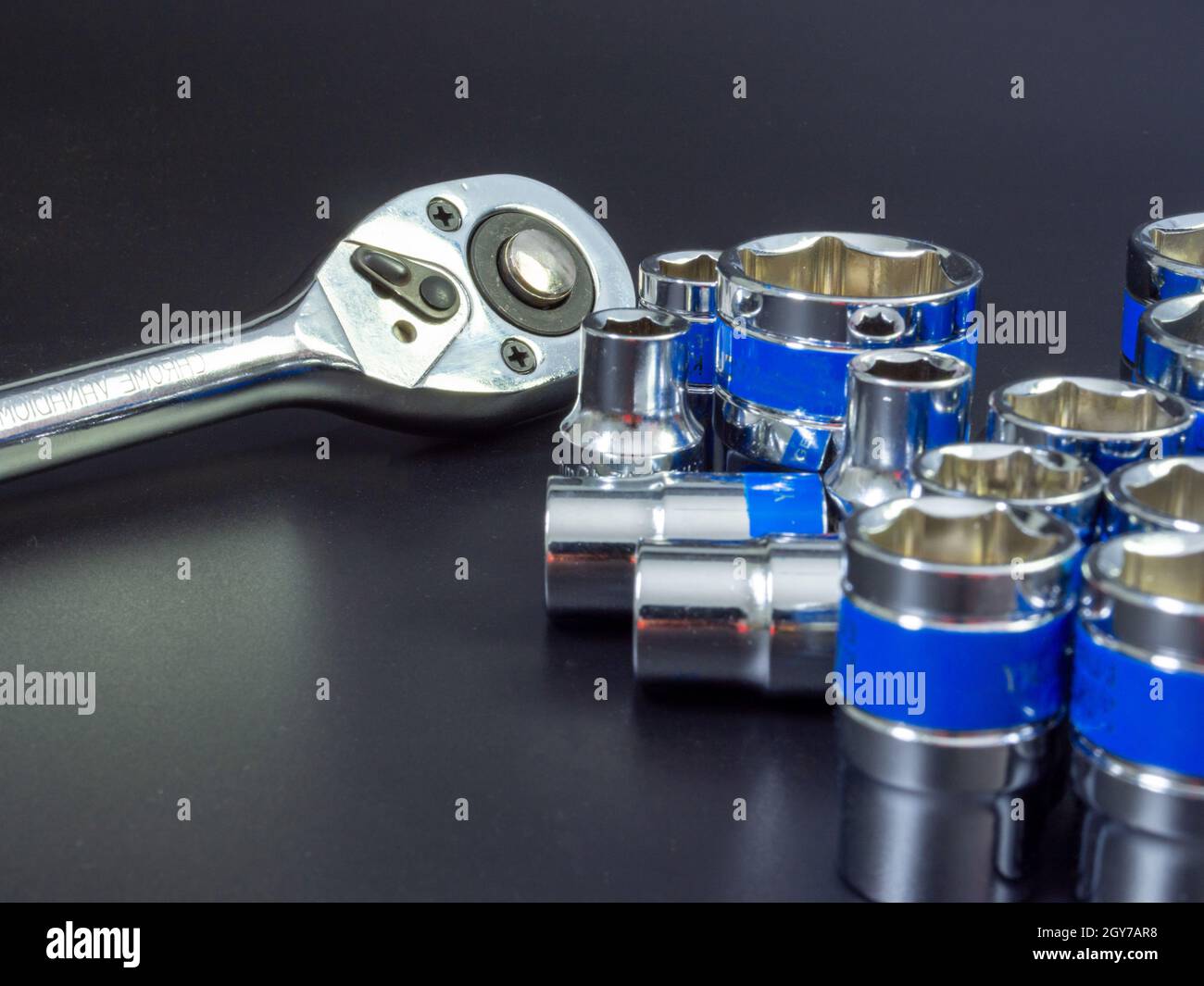 block wrench set and ratchet wrench on a black background Stock Photo ...