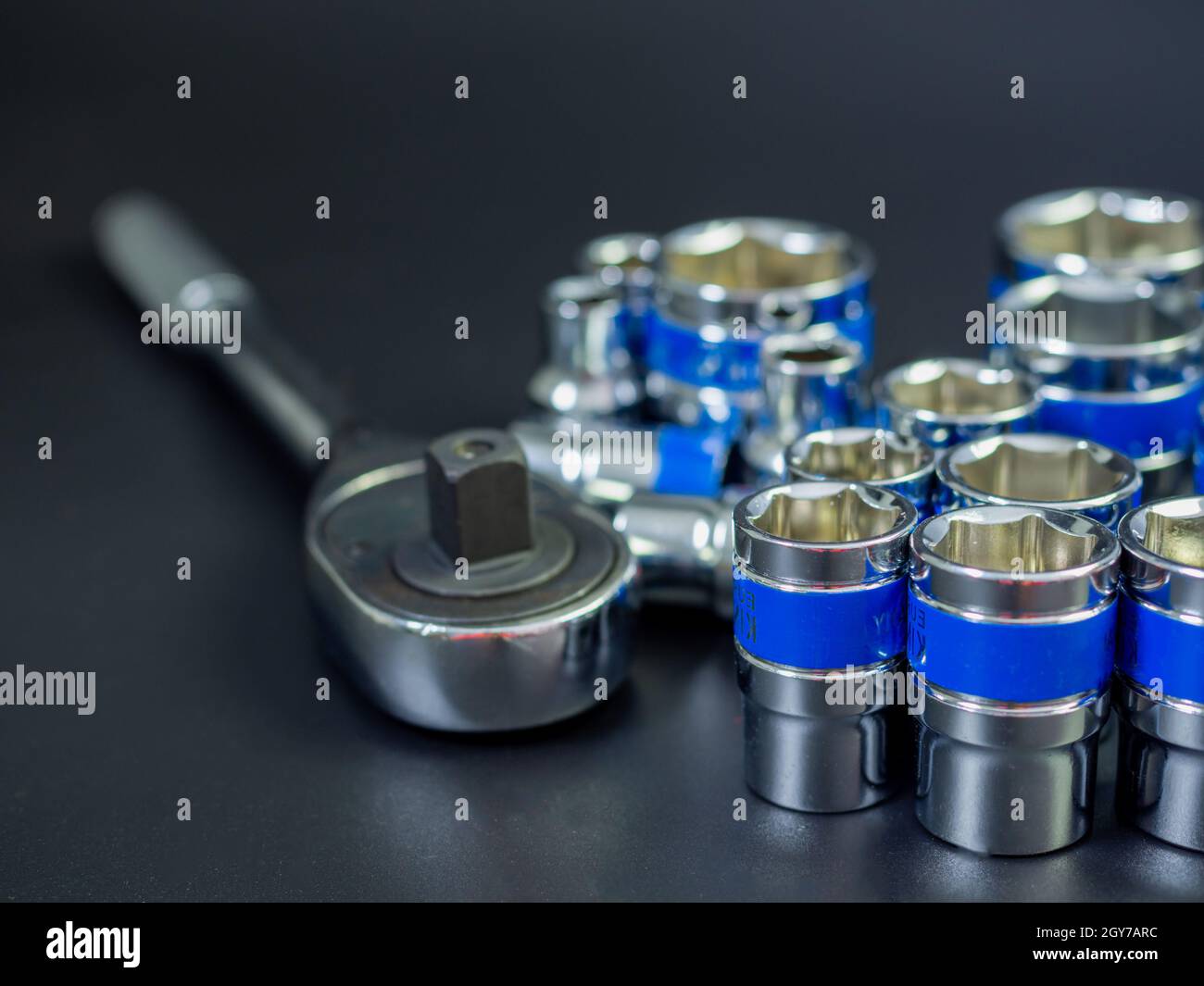 block wrench set and ratchet wrench on a black background.Block wrench ...