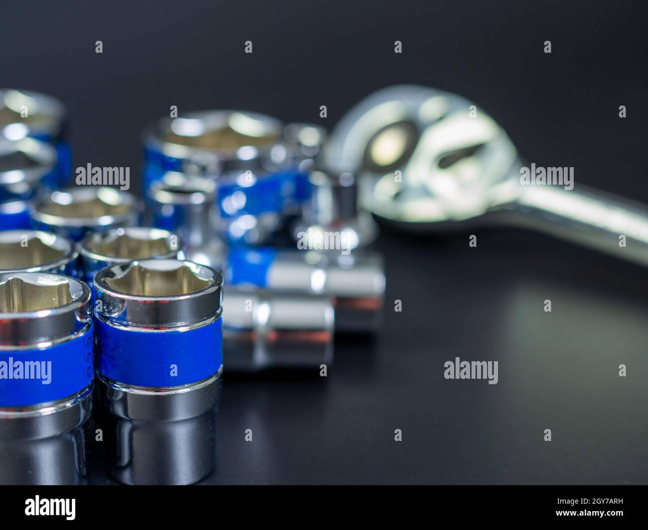 block wrench set and ratchet wrench on a black background.Block wrench ...