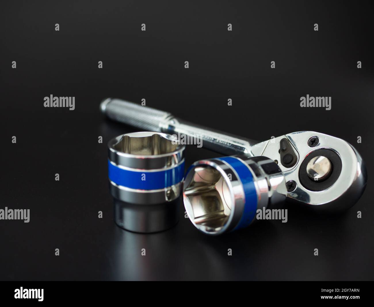 block wrench set and ratchet wrench on a black background.Block wrench ...