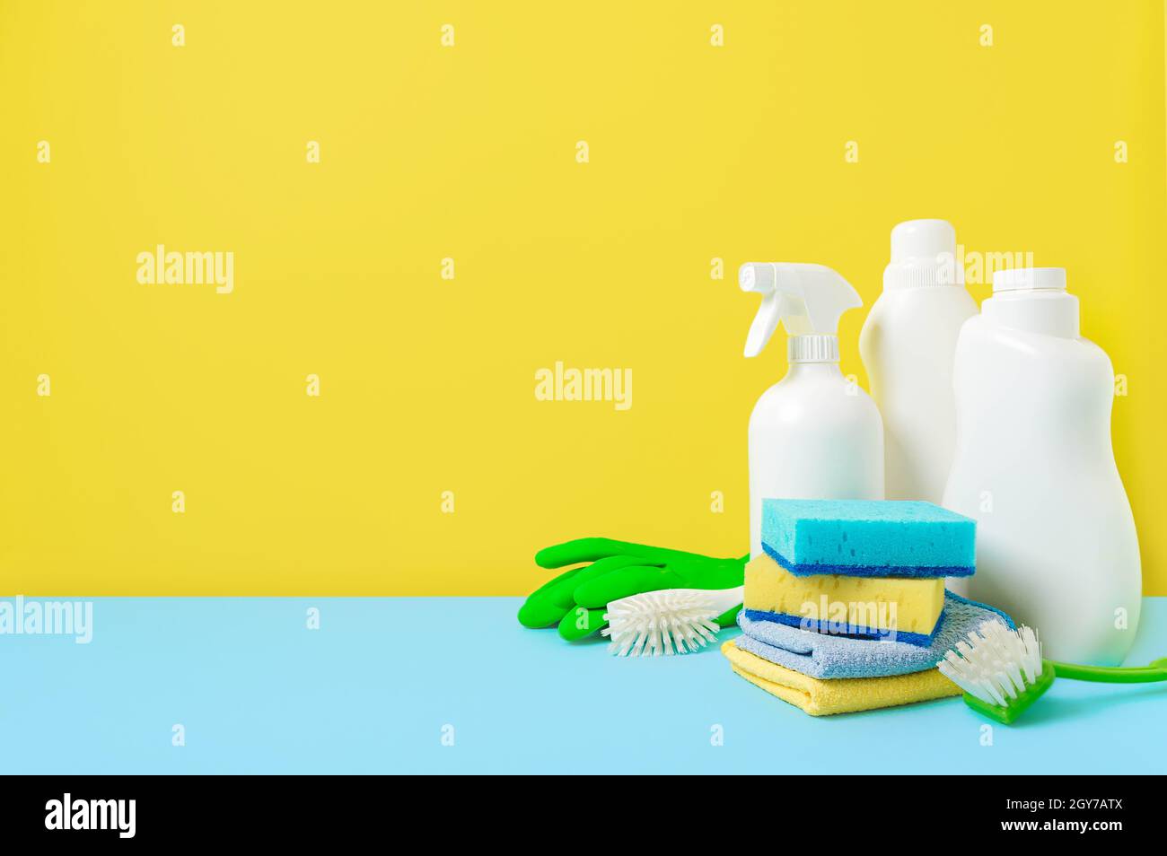 House cleaning products on yellow blue background, copy space. Cleaning ...