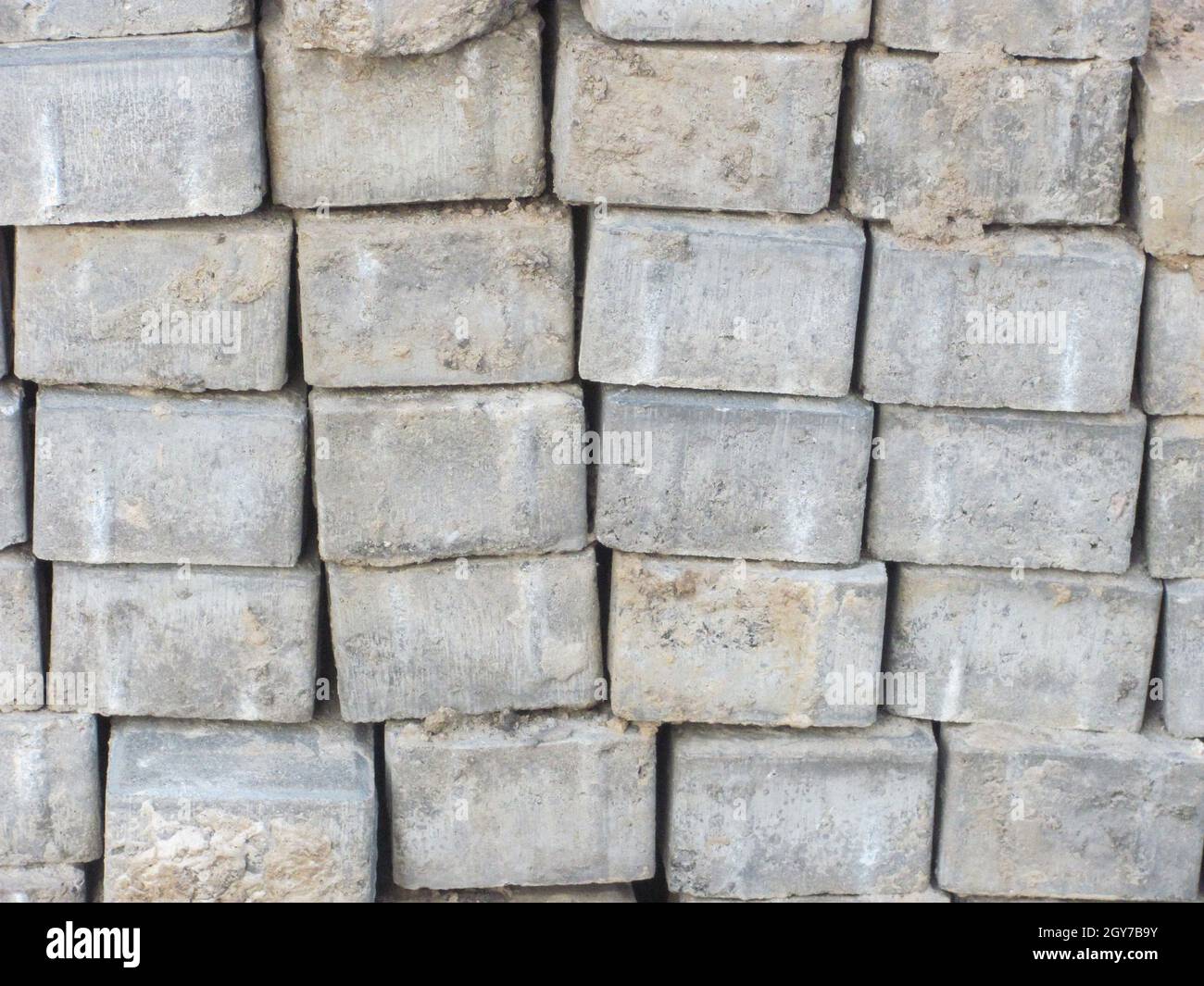 A stack of dirty gray bricks Stock Photo - Alamy