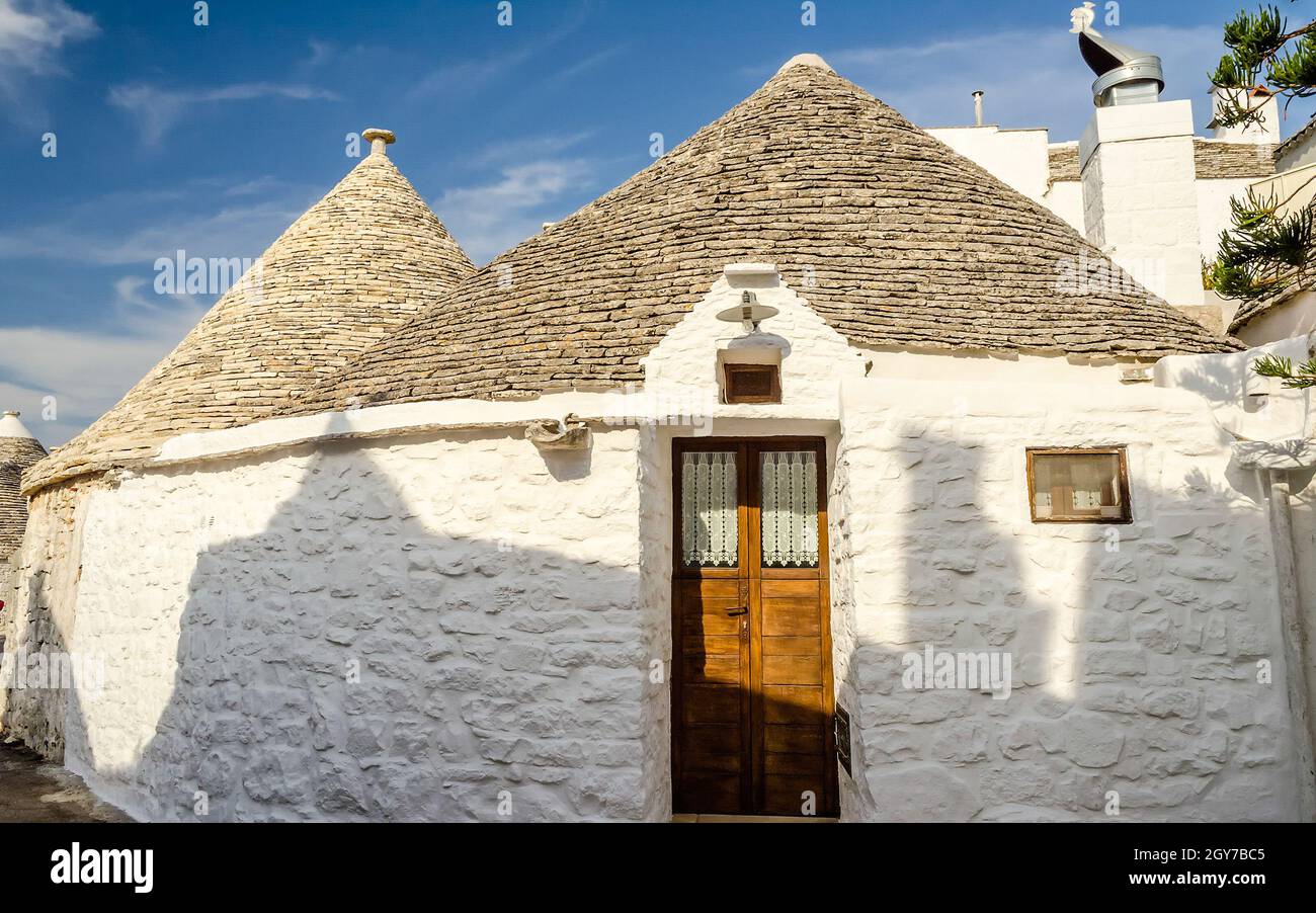Typical trulli buildings with conical roofs in Alberobello, Apulia ...