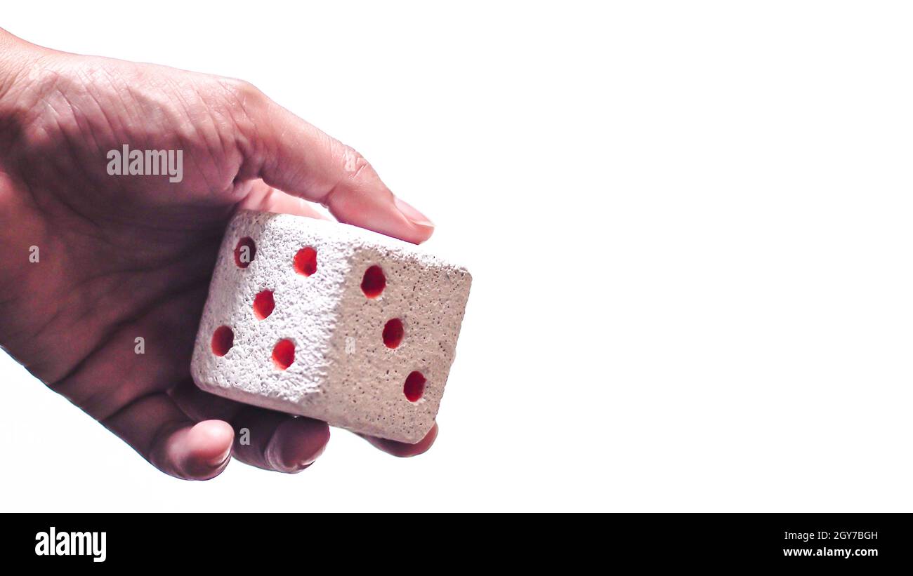 Hand & Rolling Dice. Hand rolls a dices on white isolated background ...