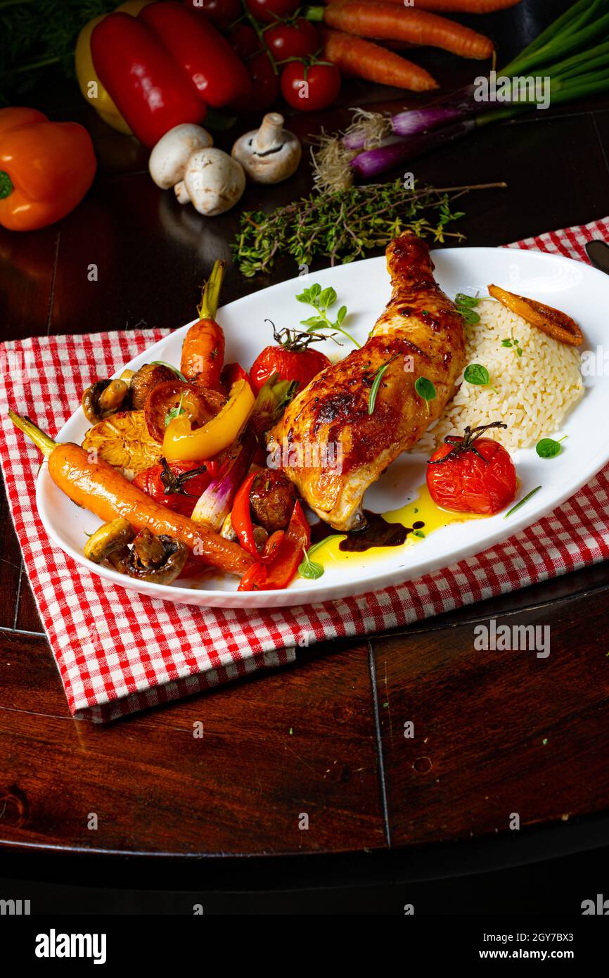 Rustic fried chicken legs with assorted vegetables and rice Stock Photo ...