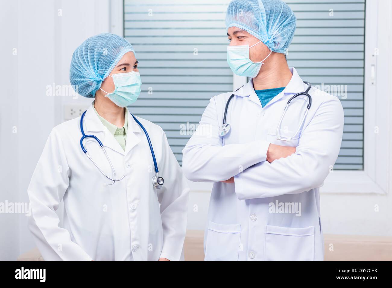 Confident professional woman doctor and nurse man smile wearing medical ...