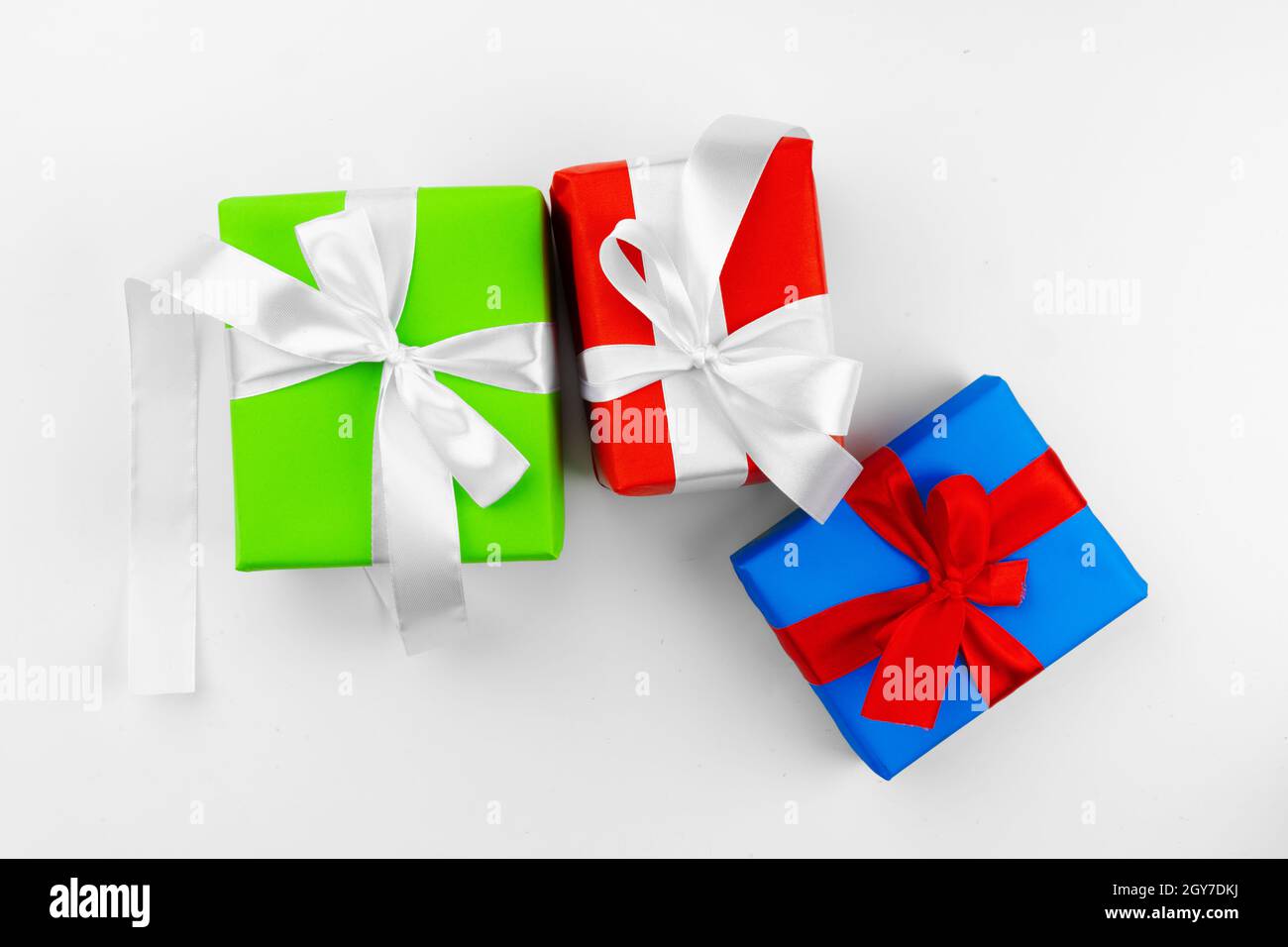 Three beautiful wrapped gifts isolated on white background Stock Photo ...