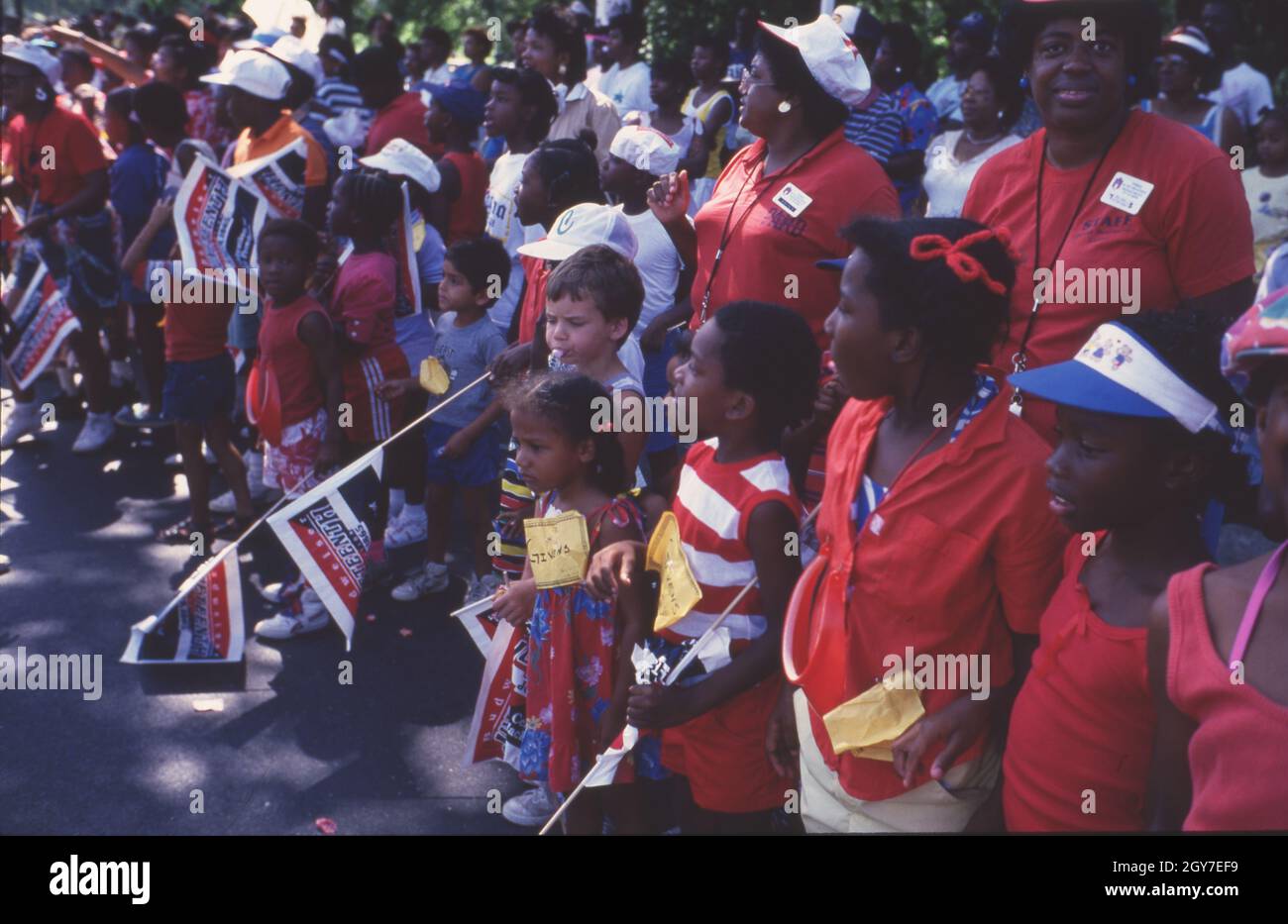 Austin Texas USA, June 1992: Spectators stand on the sidewalk and watch ...