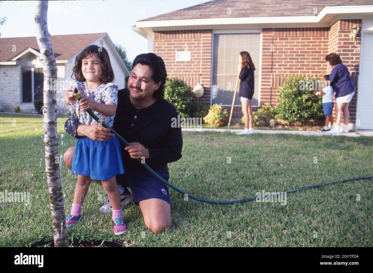 Hispanic kids doing chores hi-res stock photography and images - Alamy
