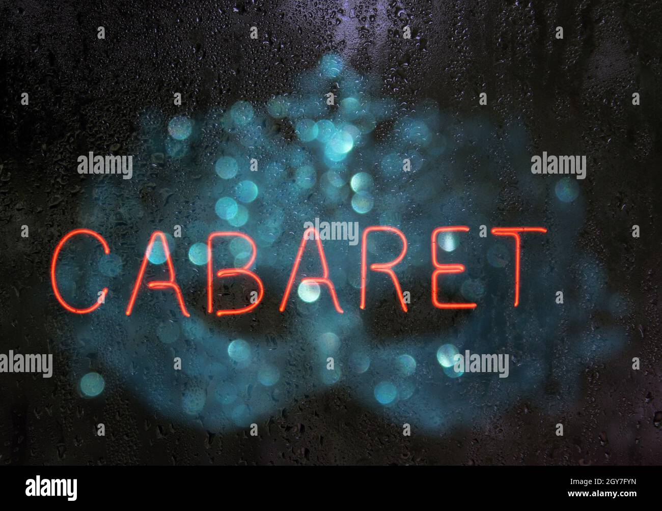 Vintage Neon Cabaret Sign With Bokeh Carnival Mask Stock Photo - Alamy