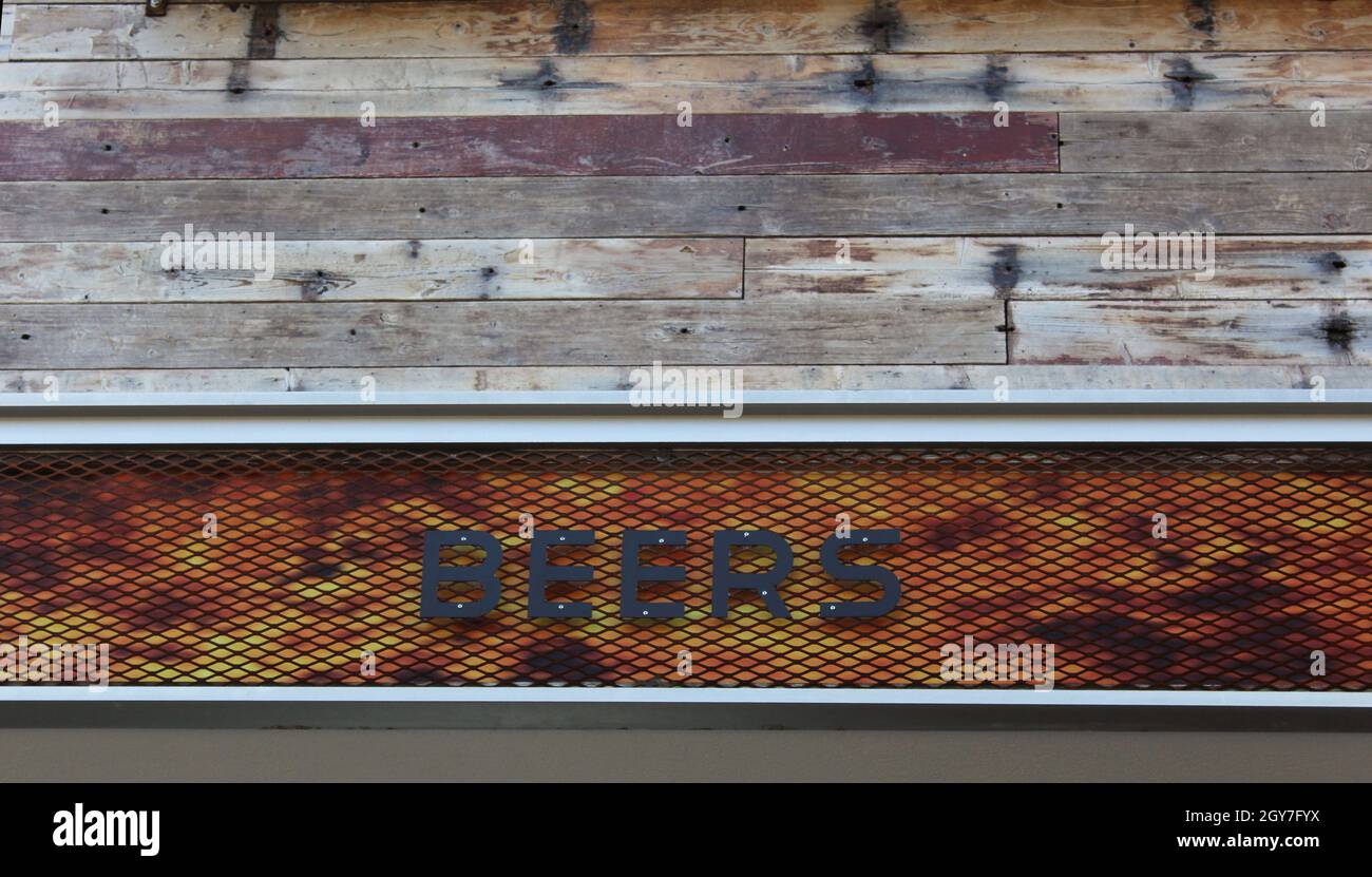 Beer sign on rustic building, Local Restaurant Sign Stock Photo - Alamy