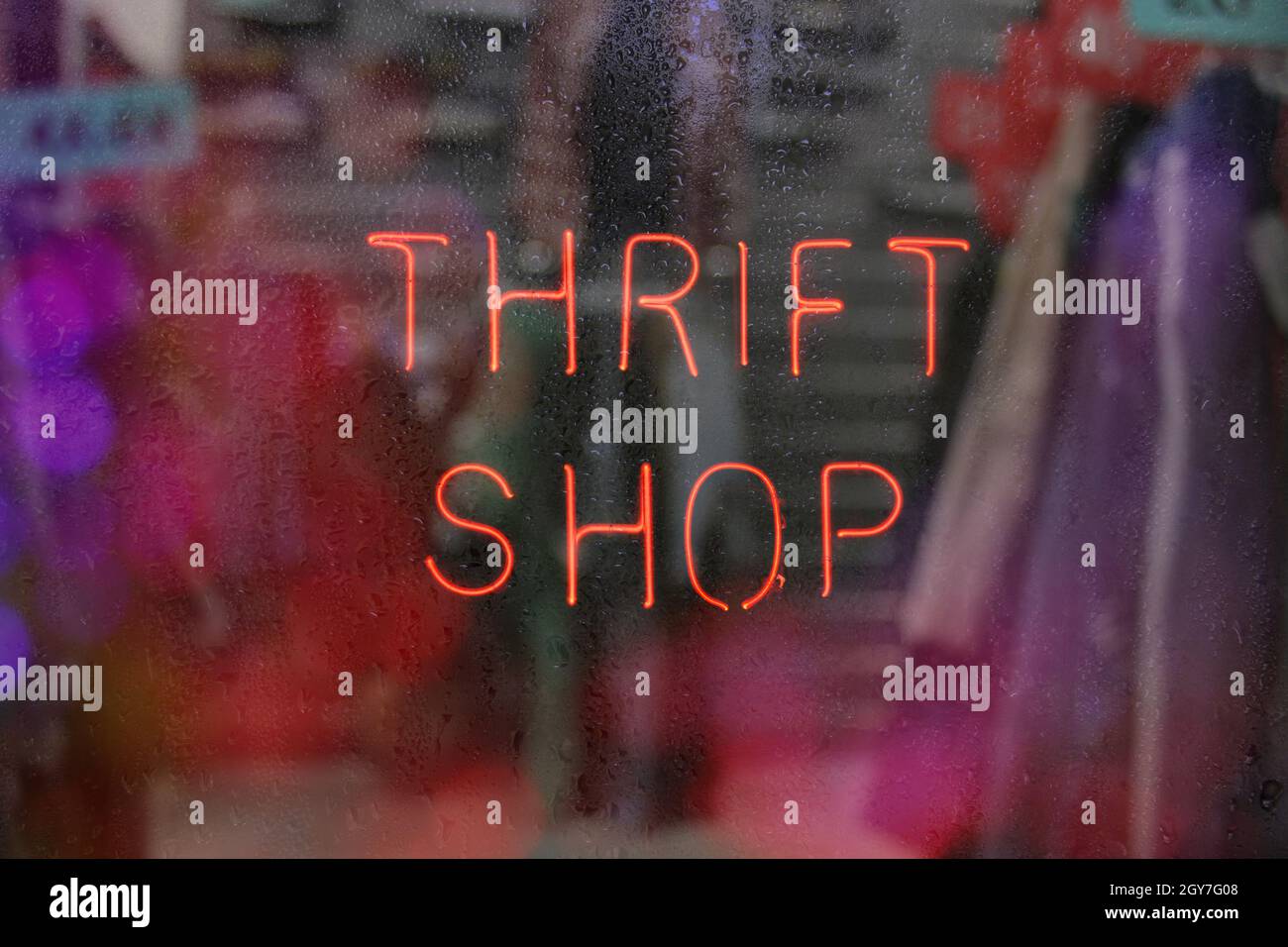 Vintage Neon Thrift Shop Sign in Wet Window Stock Photo - Alamy
