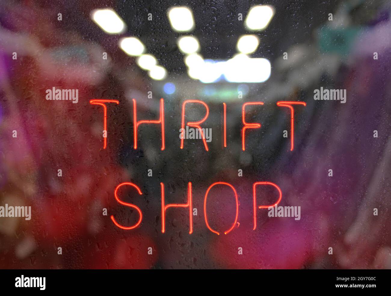 Vintage Neon Thrift Shop Sign in Wet Window Stock Photo - Alamy