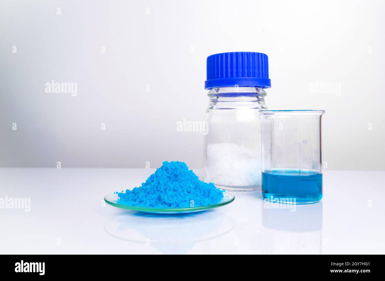 Inorganic chemical on white laboratory table. Microcrystalline wax ...