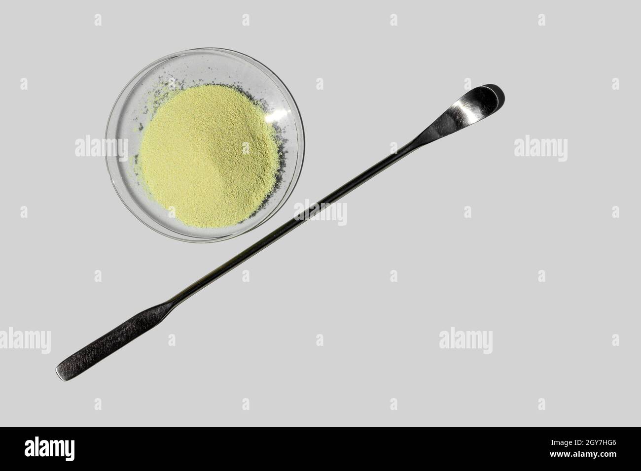 Optiblanc powder in chemical watch glass placed next to the stirring ...