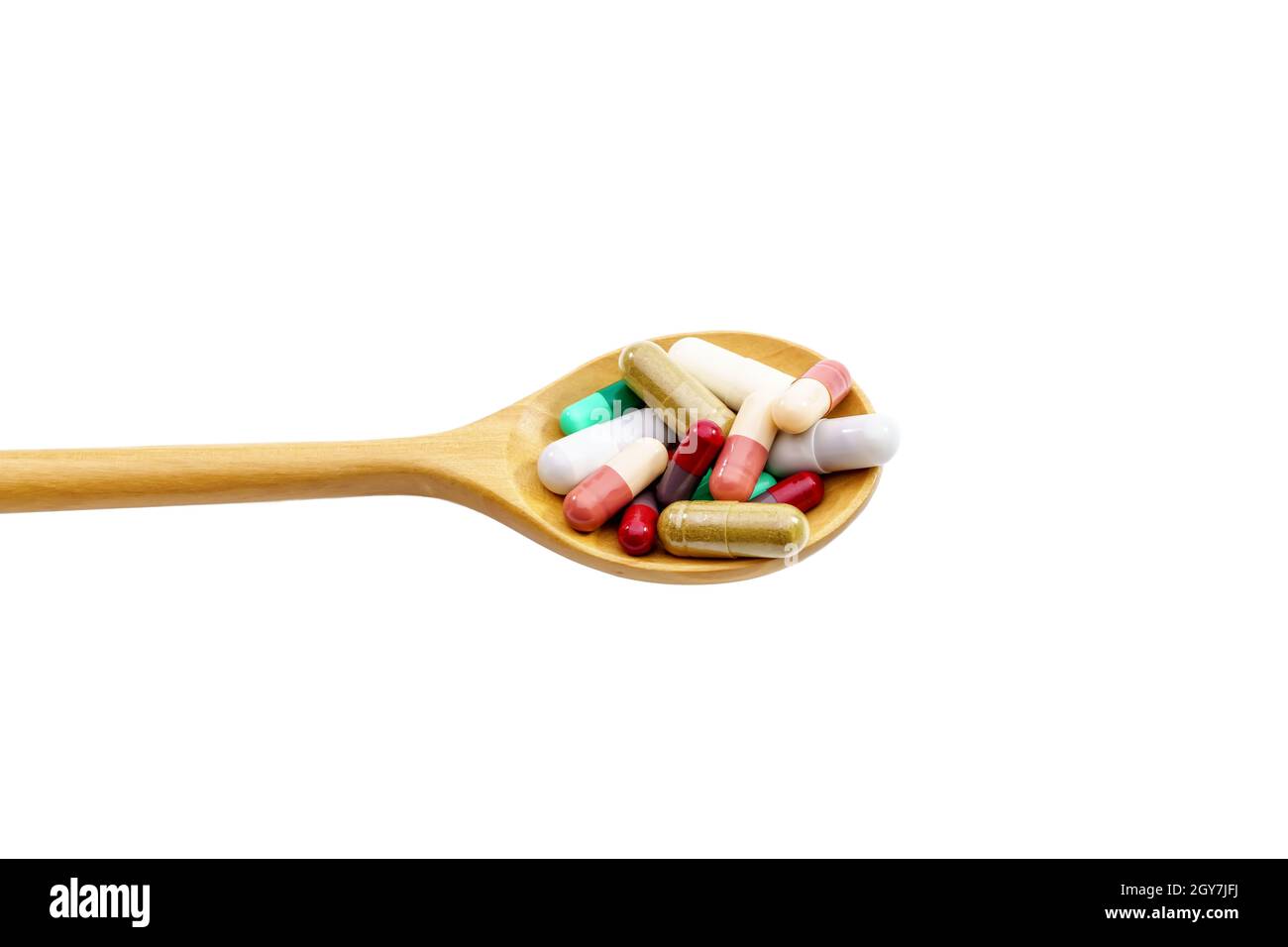 Many types of medications are on the wooden spoon Stock Photo - Alamy