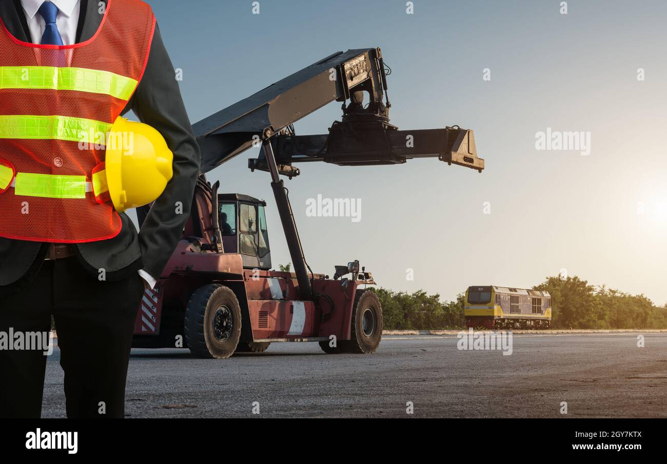 Businessman stand on front forklift loading Containers box to Logistic ...