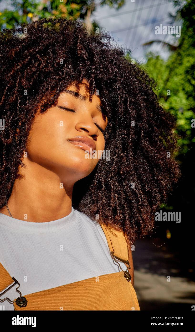 Afro Latin girl enjoying nature Stock Photo - Alamy