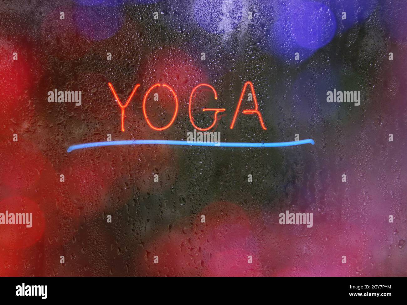 Vintage Neon Yoga Sign on Black Background Stock Photo - Alamy
