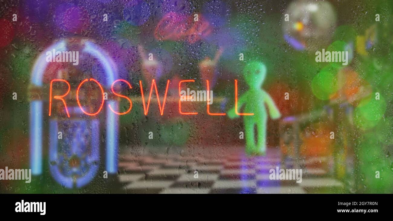 Neon Roswell Sign With Blur Cafe Background Stock Photo - Alamy
