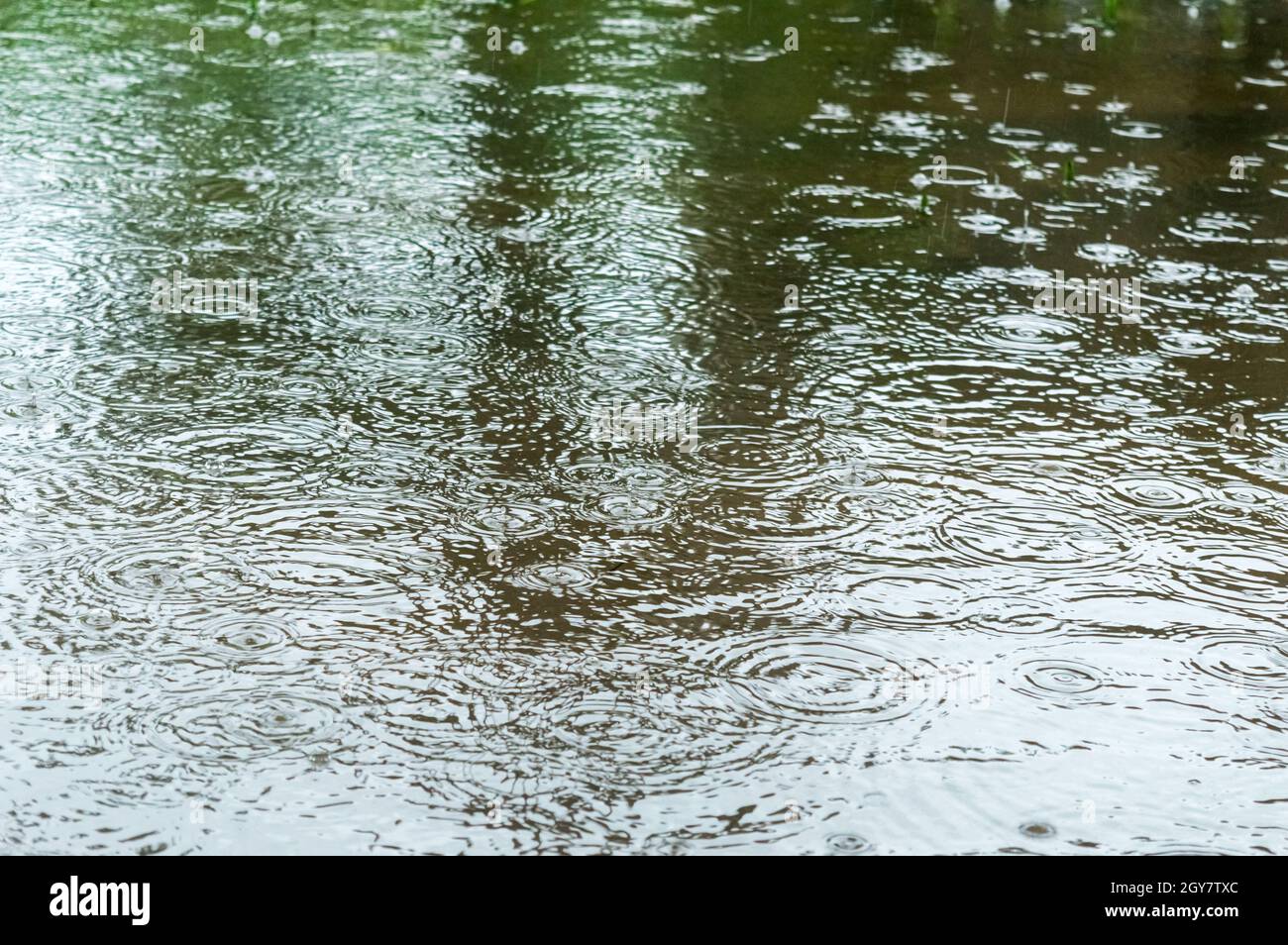 Raindrops falling on water. Rain Drops On water surface. Abstract ...