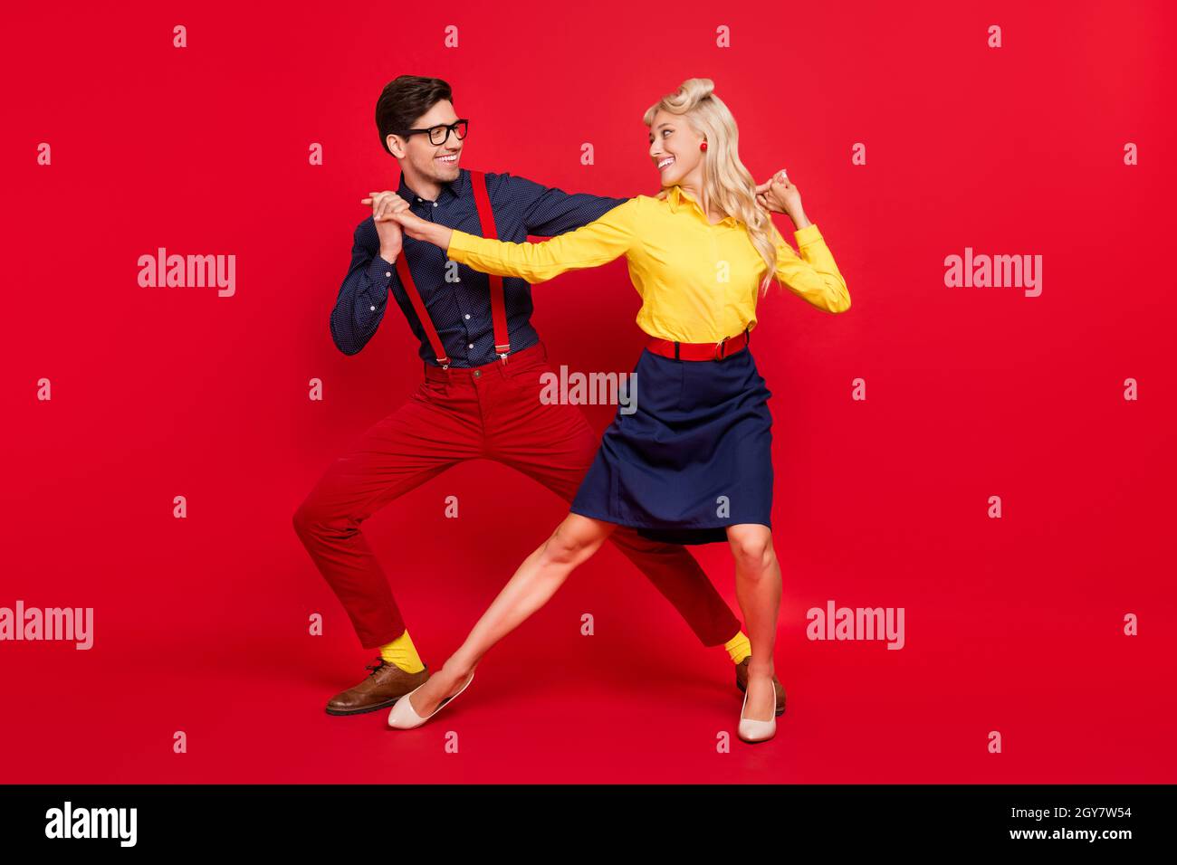 Full length body size view of attractive cheerful couple dancing twist ...