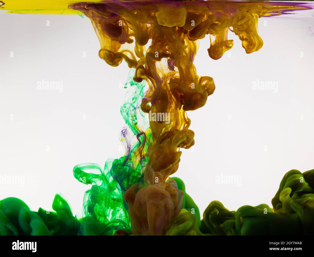 a liquid splash dissolve color Stock Photo - Alamy