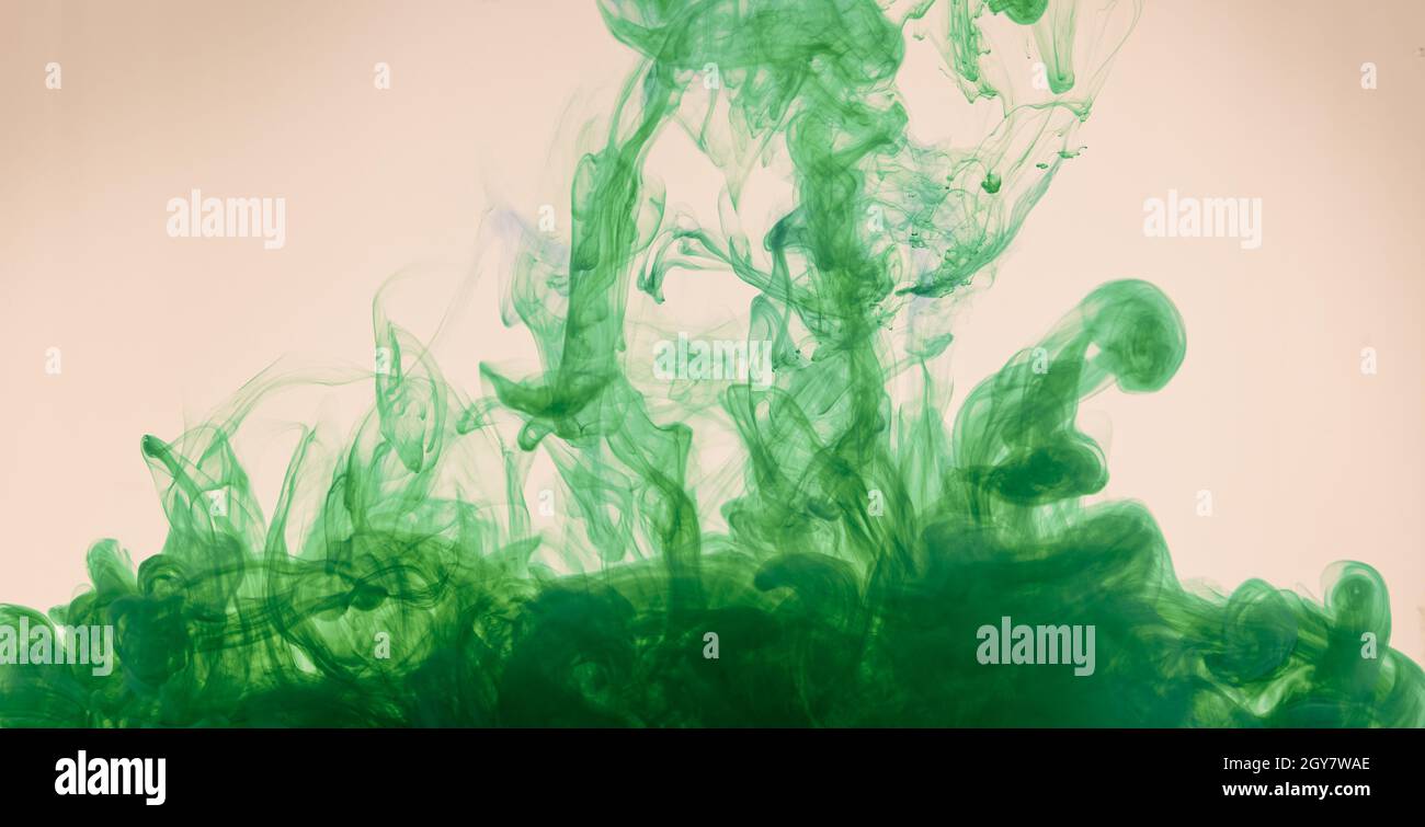 a liquid splash dissolve color Stock Photo - Alamy