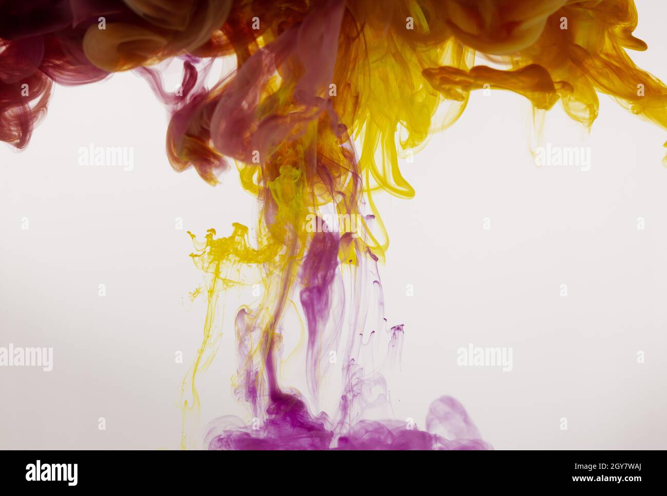 a liquid splash dissolve color Stock Photo - Alamy
