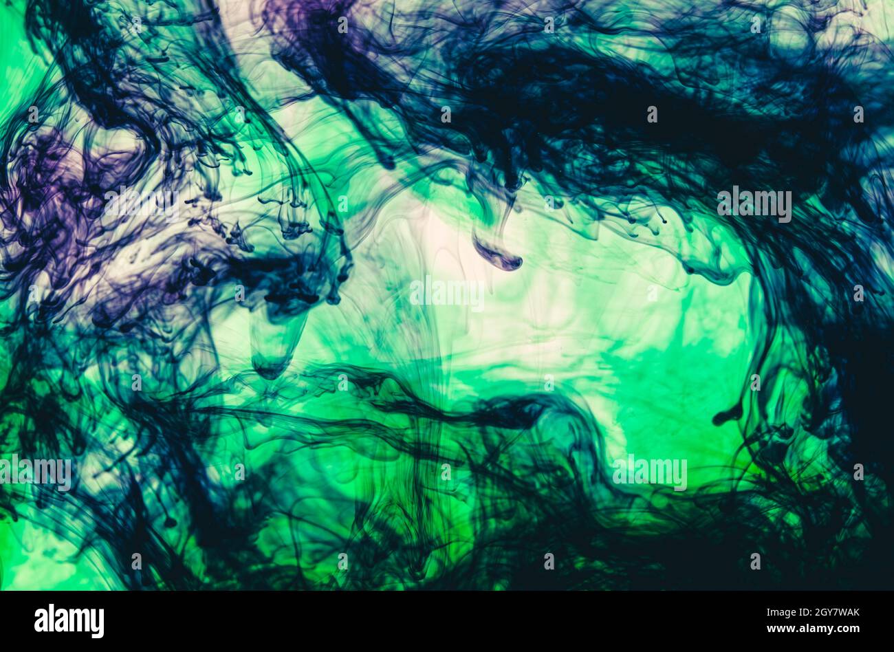 a liquid splash dissolve color Stock Photo - Alamy