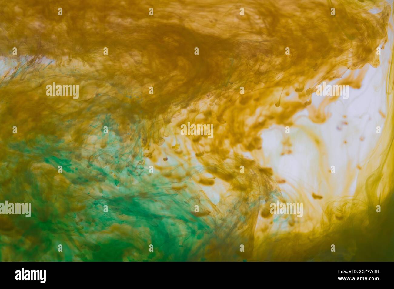 a liquid splash dissolve color Stock Photo - Alamy