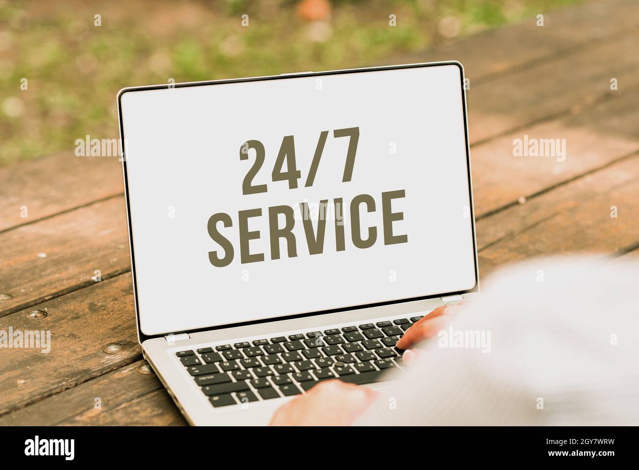 Hand writing sign 24 on 7 Service, Internet Concept providing an ...