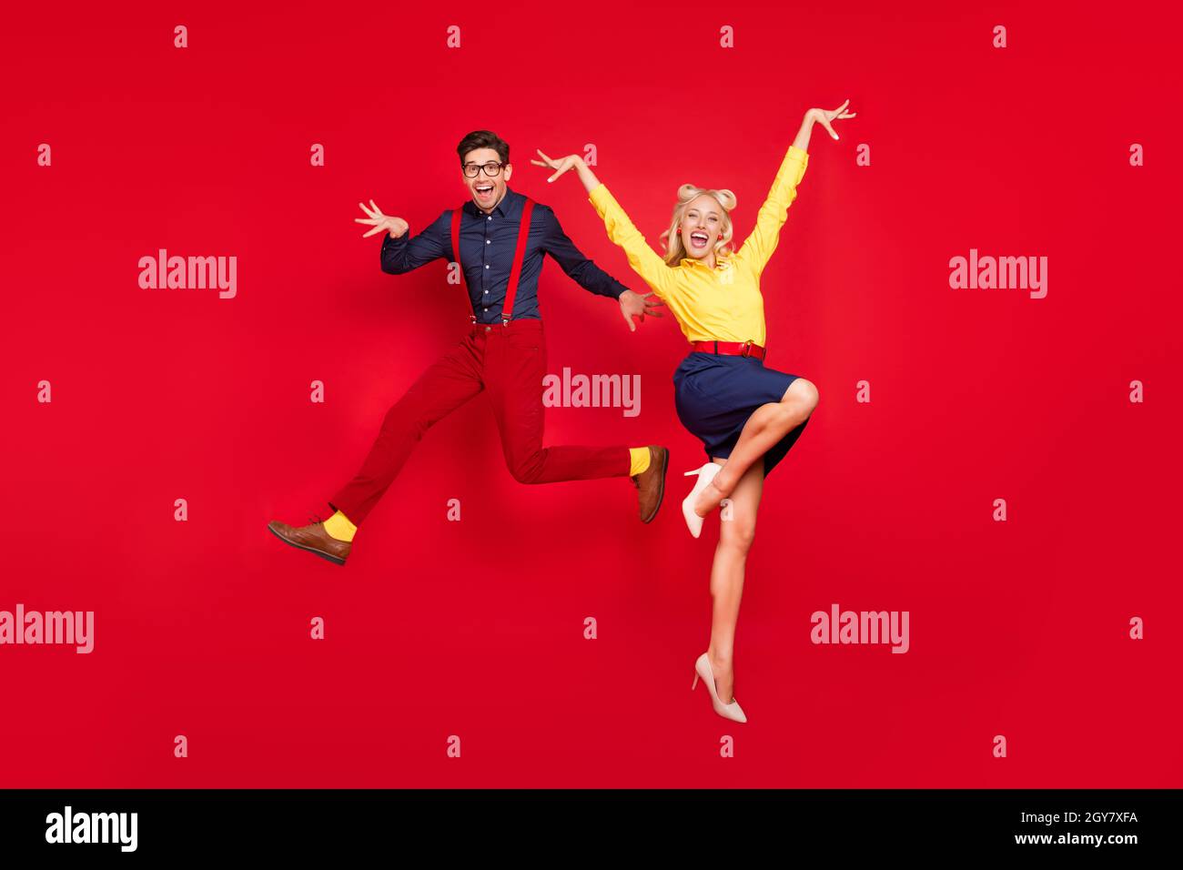 Full length body size view of trendy cheerful crazy couple jumping ...