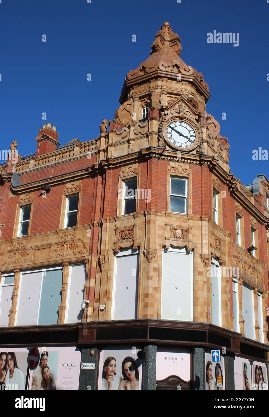 Exterior of building in Victorian quarter with clock on corner of ...