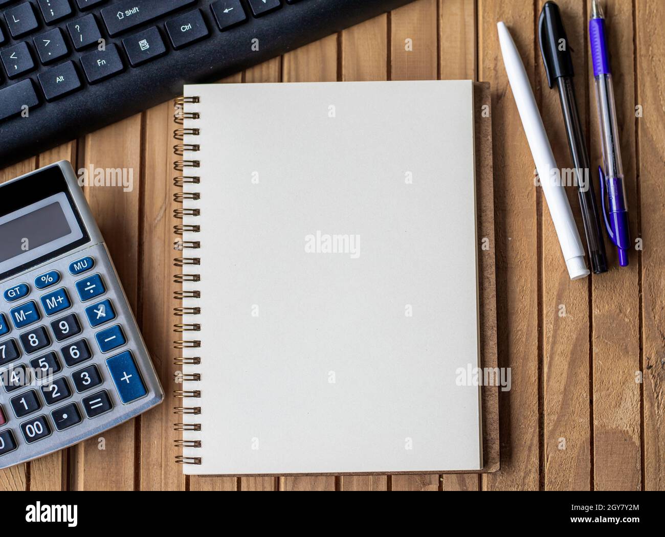 Blank Open Spiral Notebook With Calculator Keyboard Pen Placed Over ...