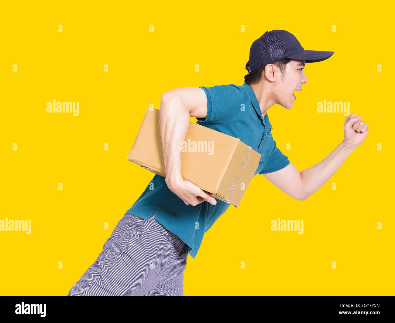 young courier holding the parcel and running fast for the delivery ...